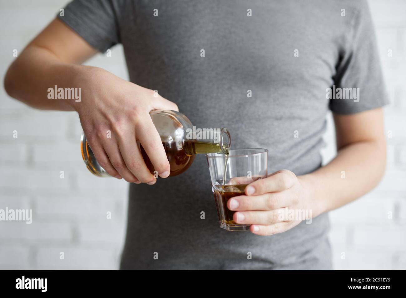 Whisky bottle hands hi-res stock photography and images - Alamy