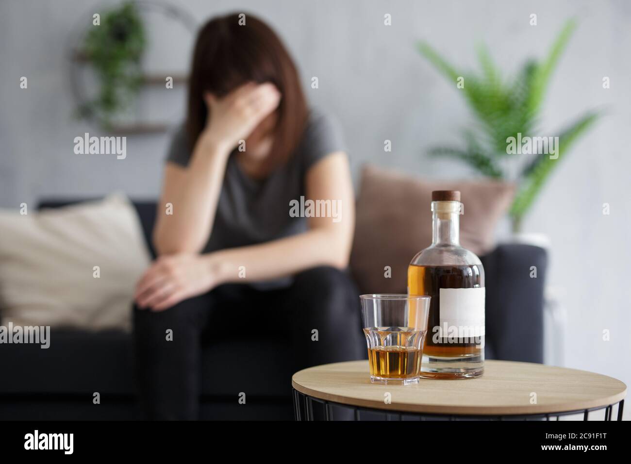 female alcoholism and depression concept - young woman crying and ...