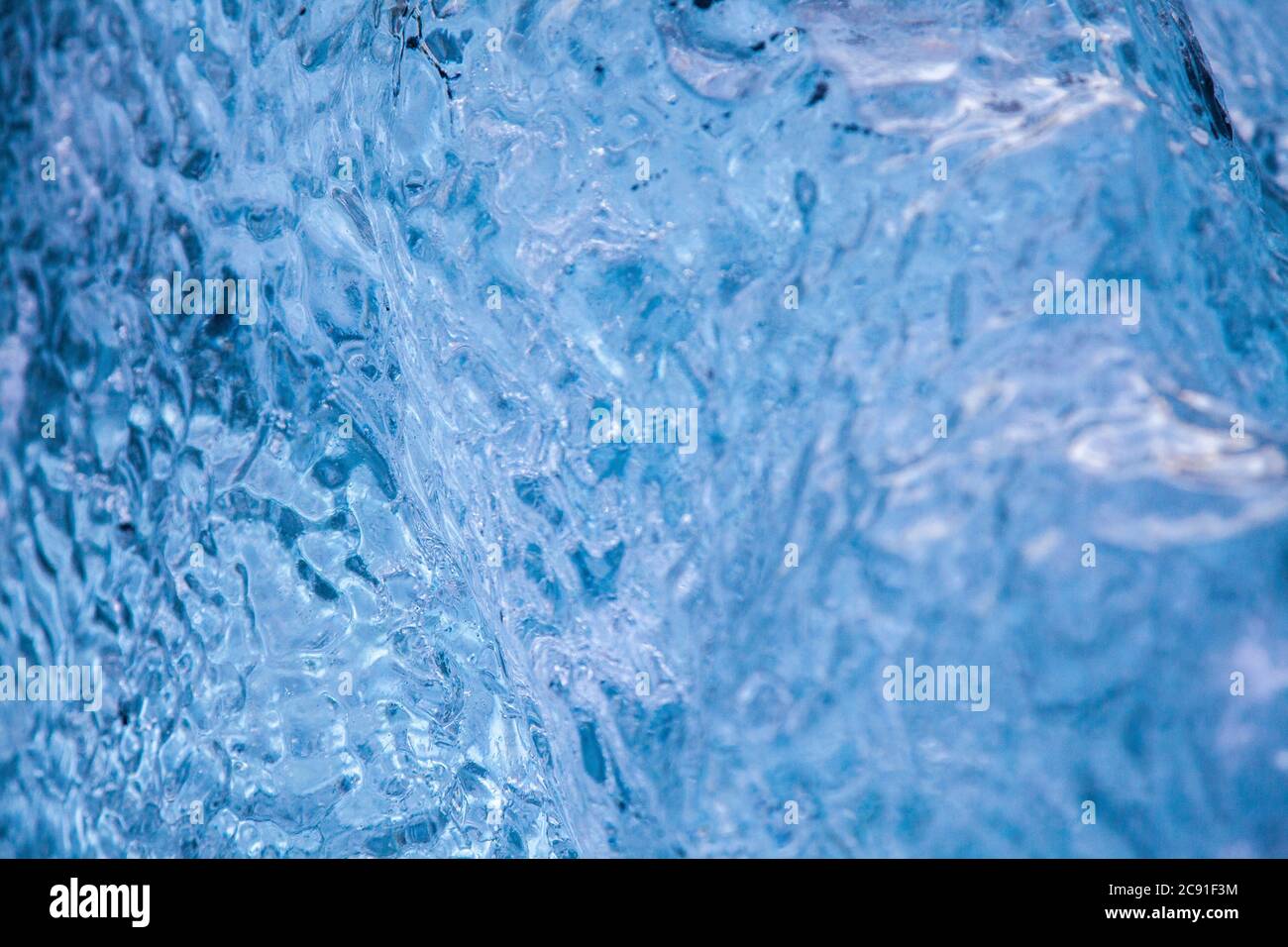 A famous beach in Iceland with a lot pieces of ice on the sand that ...