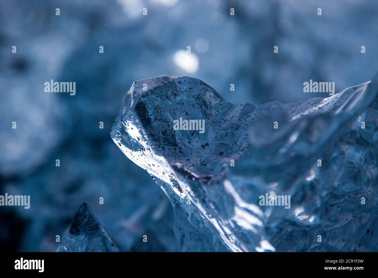 A famous beach in Iceland with a lot pieces of ice on the sand that ...