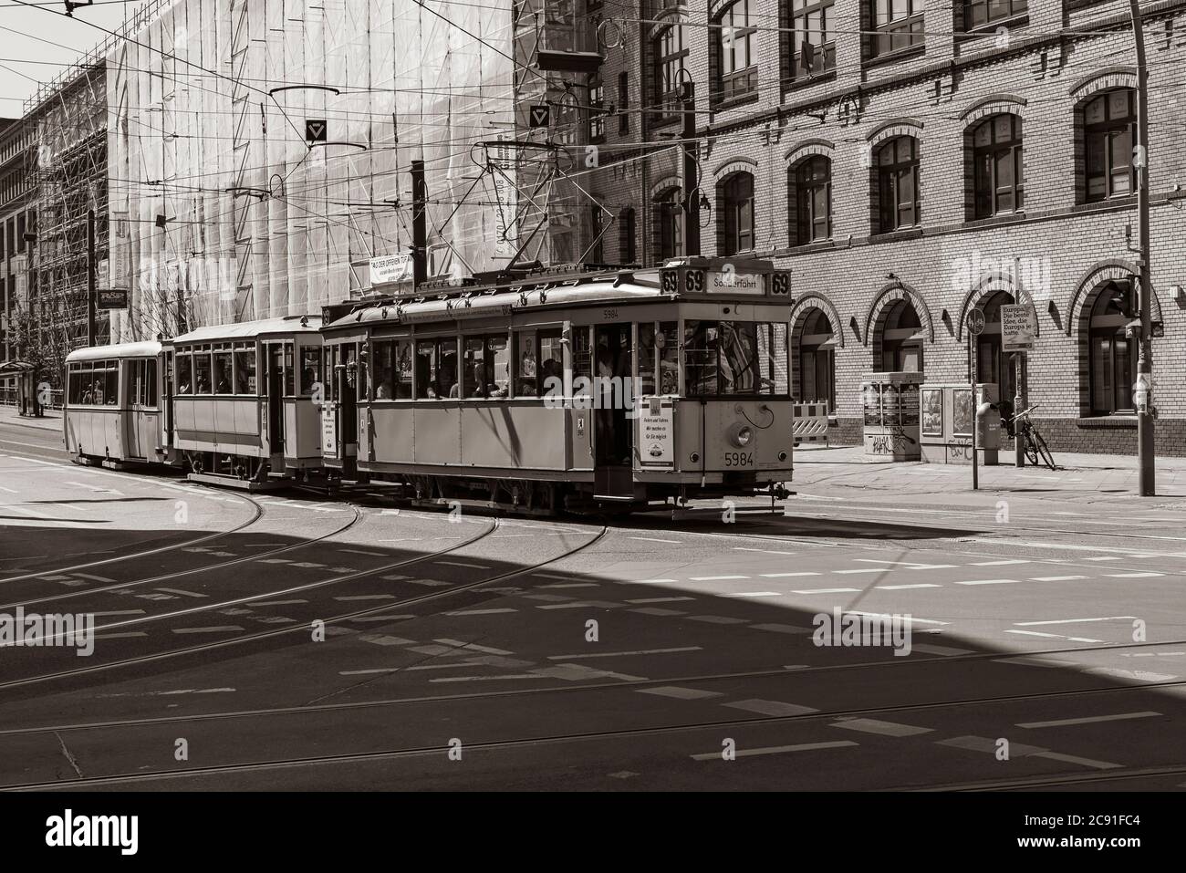 An old historical tram crossing an intersection, old tram in Berlin ...