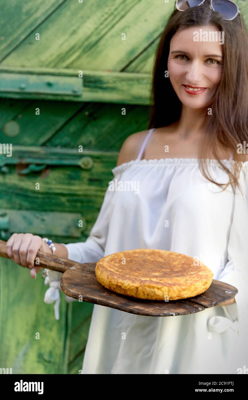 Smiling woman holding paddle hi-res stock photography and images - Alamy