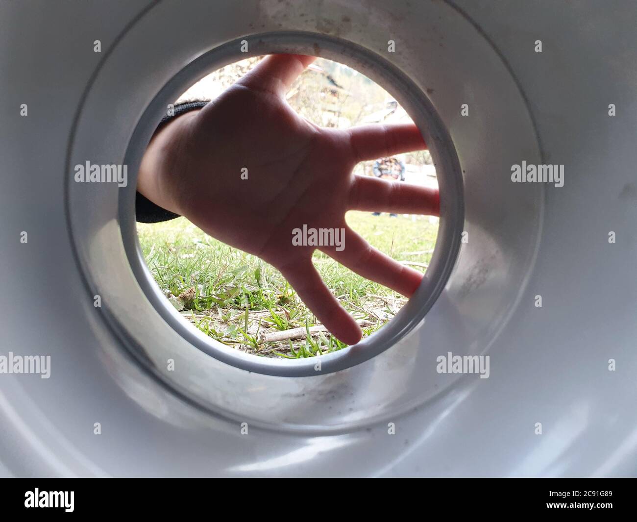 Children playing with teddy bear in a park. Body parts of Kids seems ...