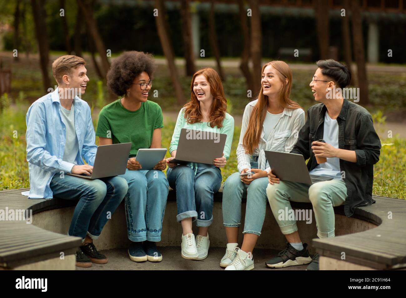 Diverse Multicultural Students Studying Outdoors With Different ...