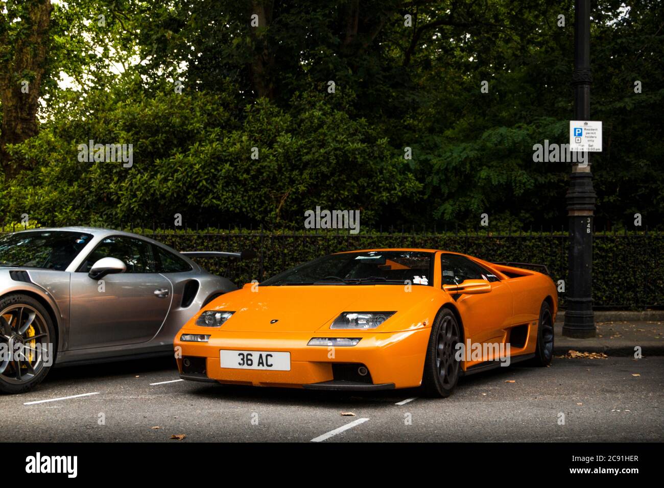 Orange Lamborghini Diablo VT classic supercar parked on a street in ...
