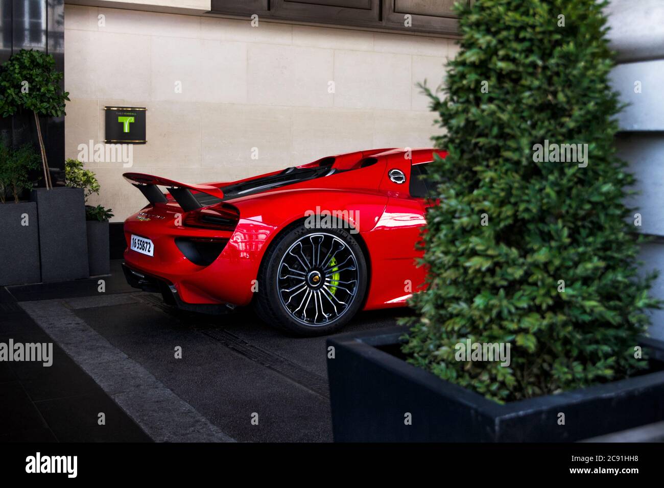 Red Porsche 918 Spyder modern supercar parked at a luxury hotel in ...