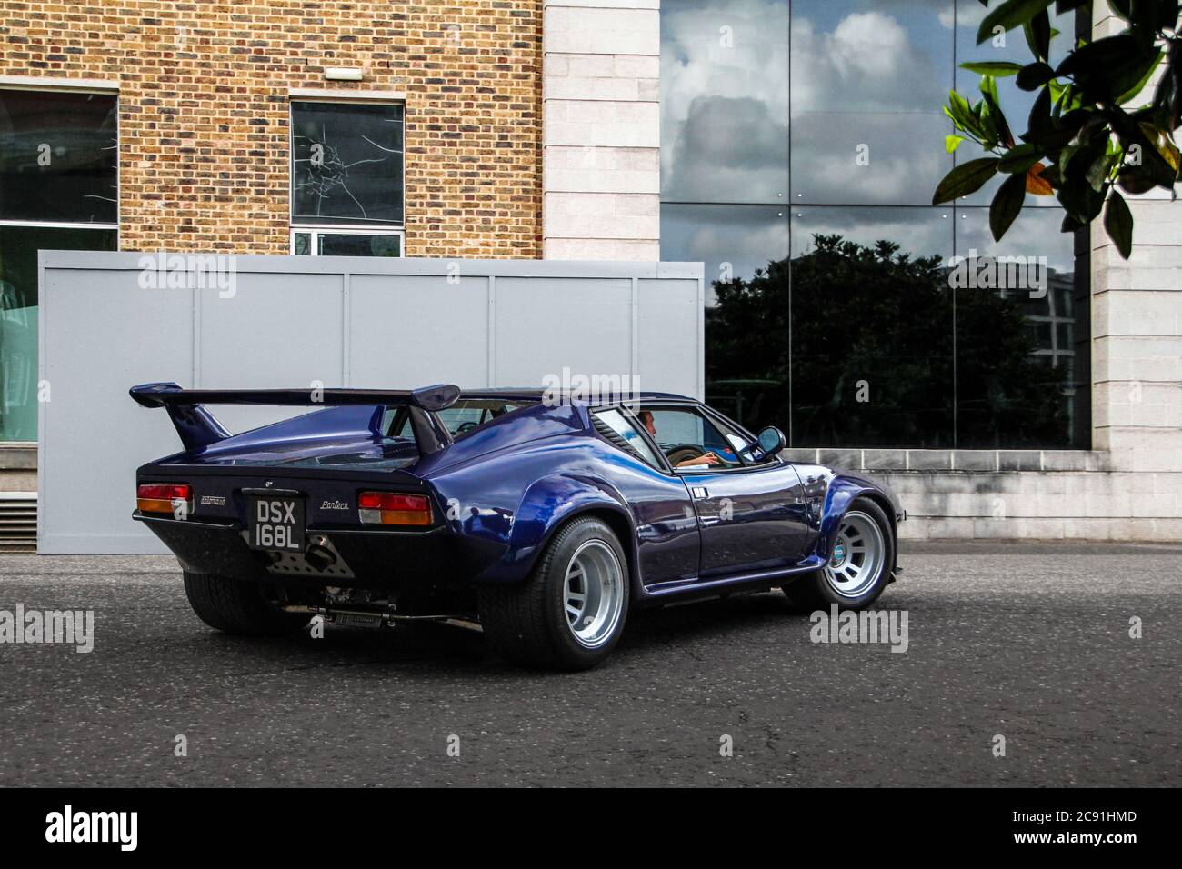 Blue DeTomaso Pantera GT5 classic supercar leaving an annual automotive ...