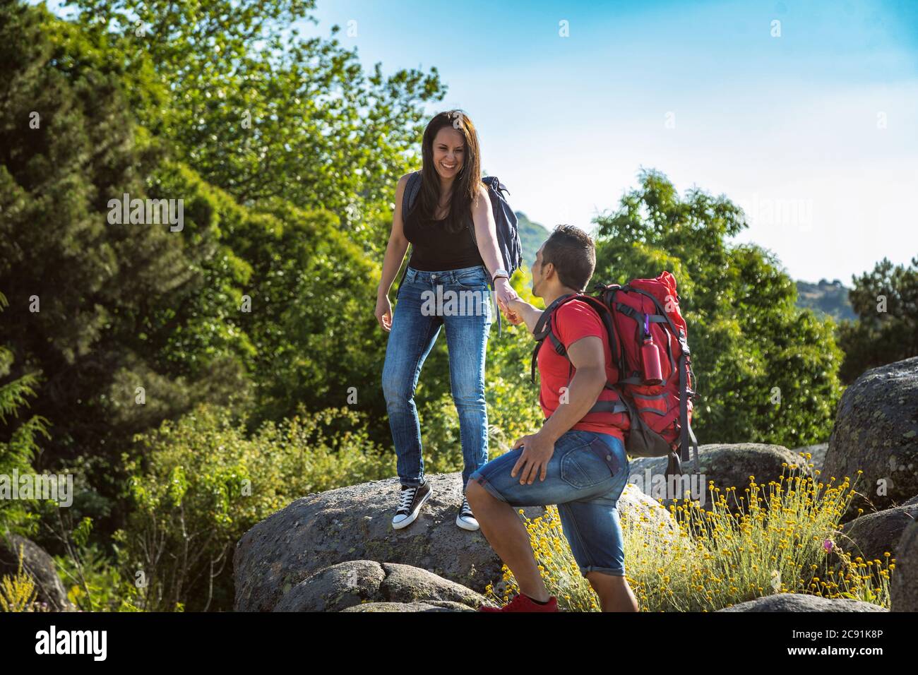 Helping girl climb tree hi-res stock photography and images - Alamy