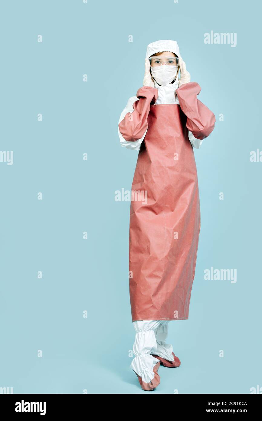 Full length portrait of surgeon in white gown with red leather apron ...