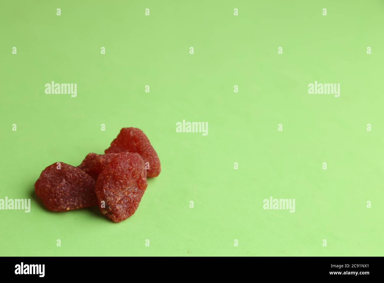 Closeup of red hard candies arranged aesthetically on one side Stock ...