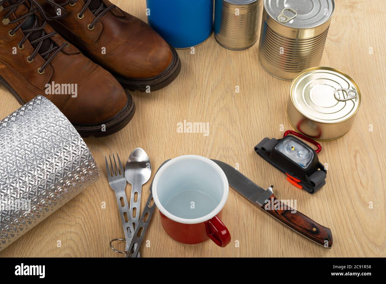Picture of camping tools on a table - gas tank, cans, etc - ready to go ...