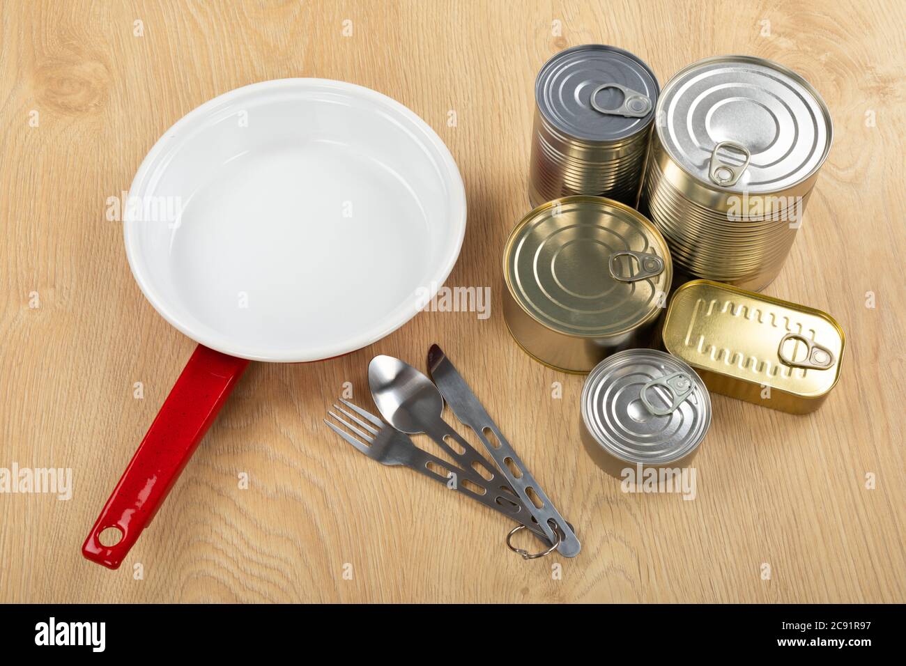 Picture of camping tools on a table - gas tank, cans, etc - ready to go ...