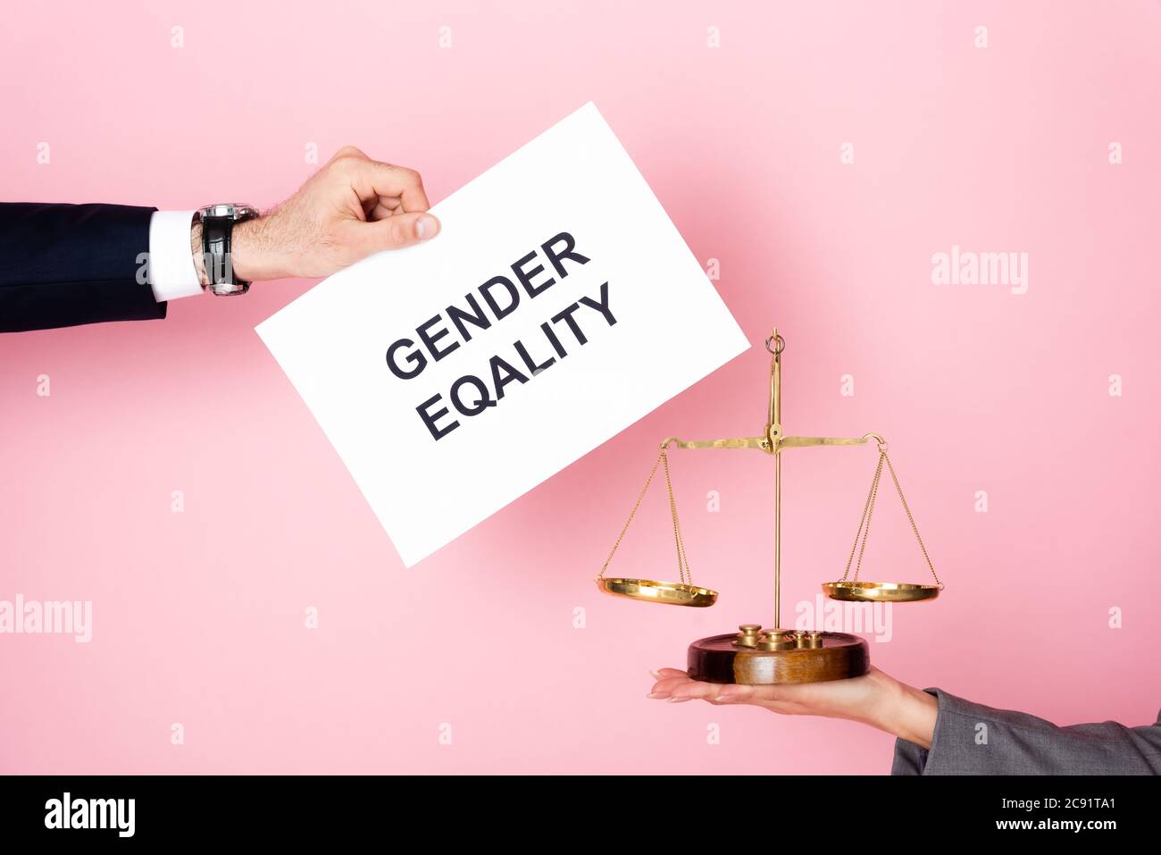 cropped view of businessman holding placard with gender equality ...