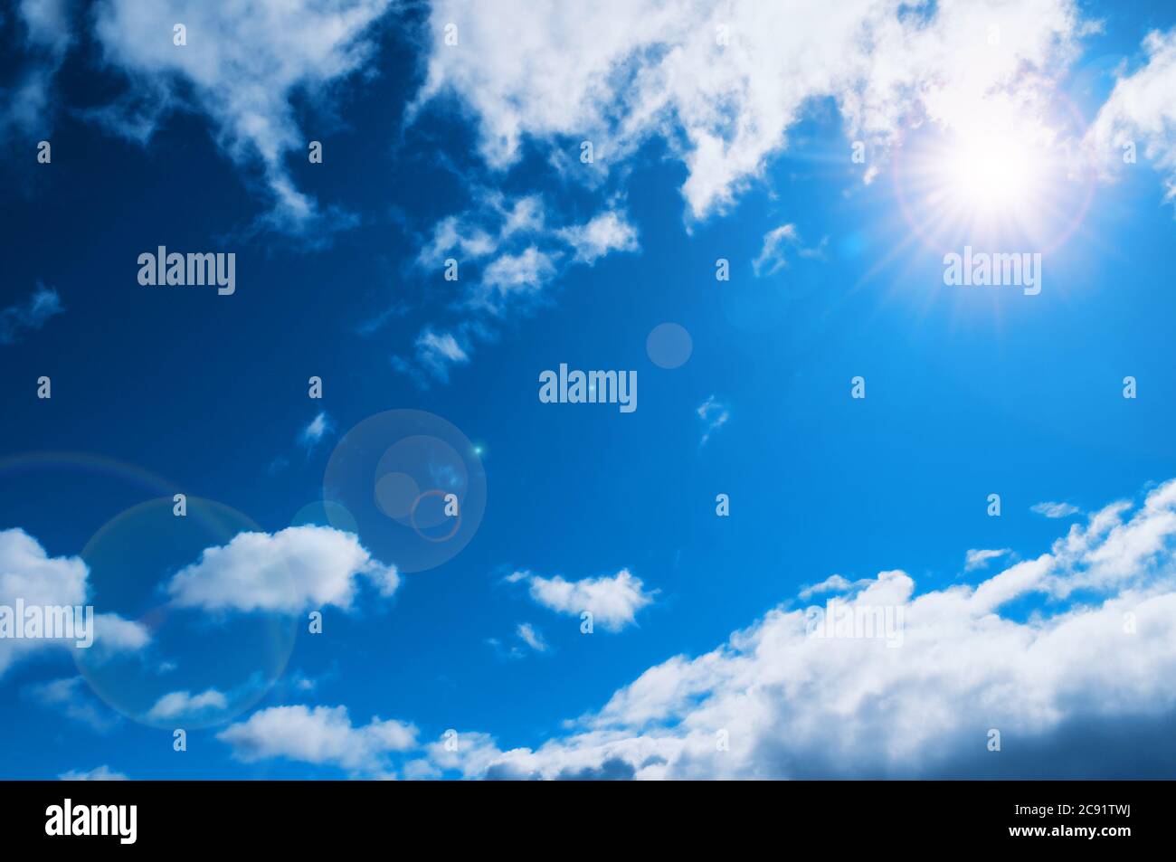 Blue sky background. Sunset clouds lit by evening soft sunlight. Vast ...