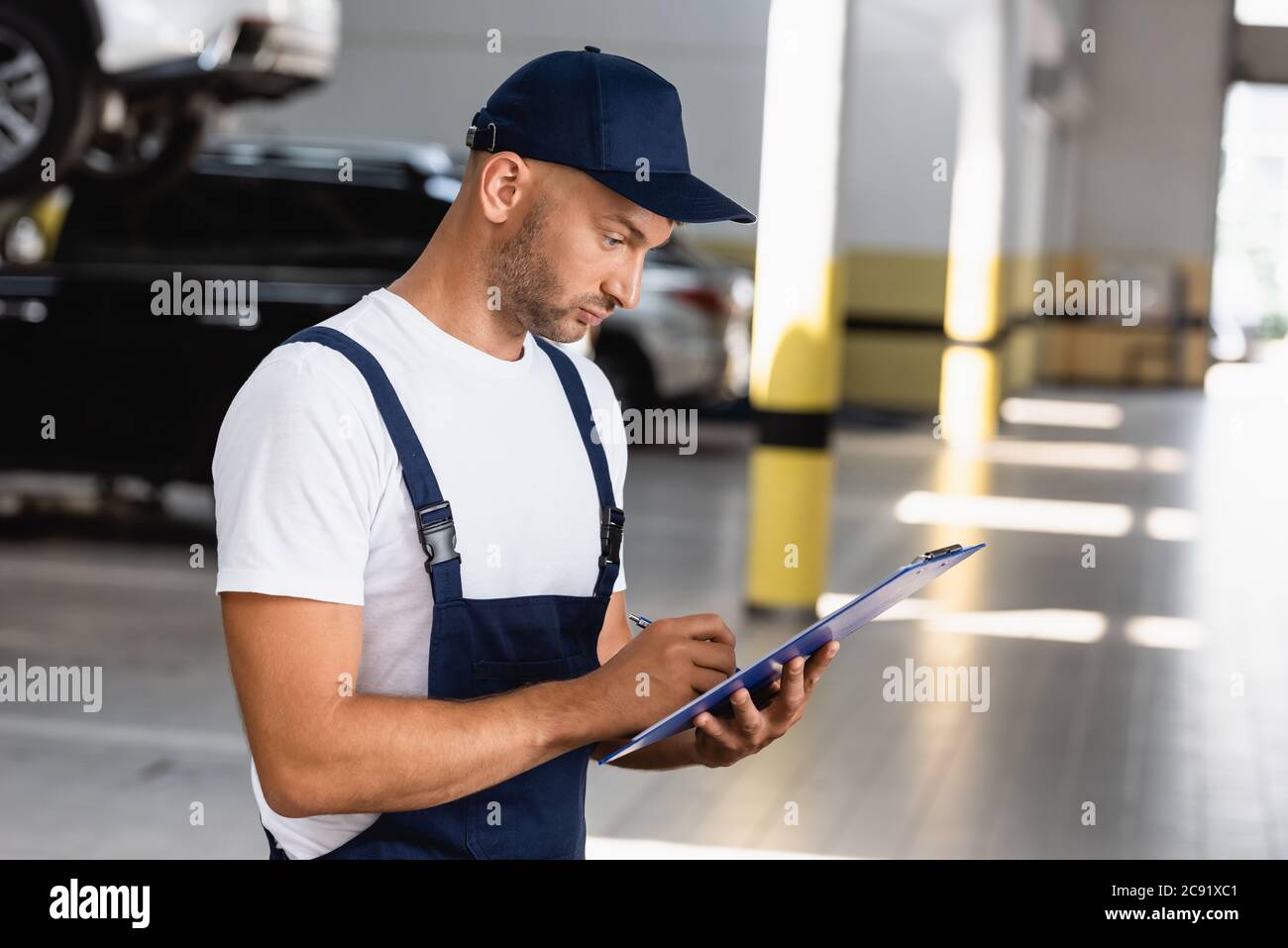Handsome mechanic in uniform hi-res stock photography and images - Alamy