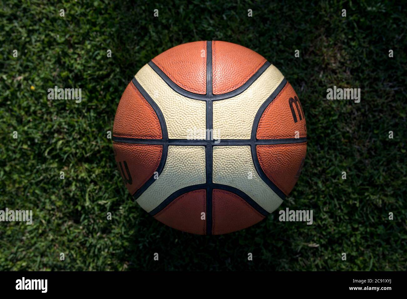 Top view of a basketball ball on the green lawn Stock Photo - Alamy