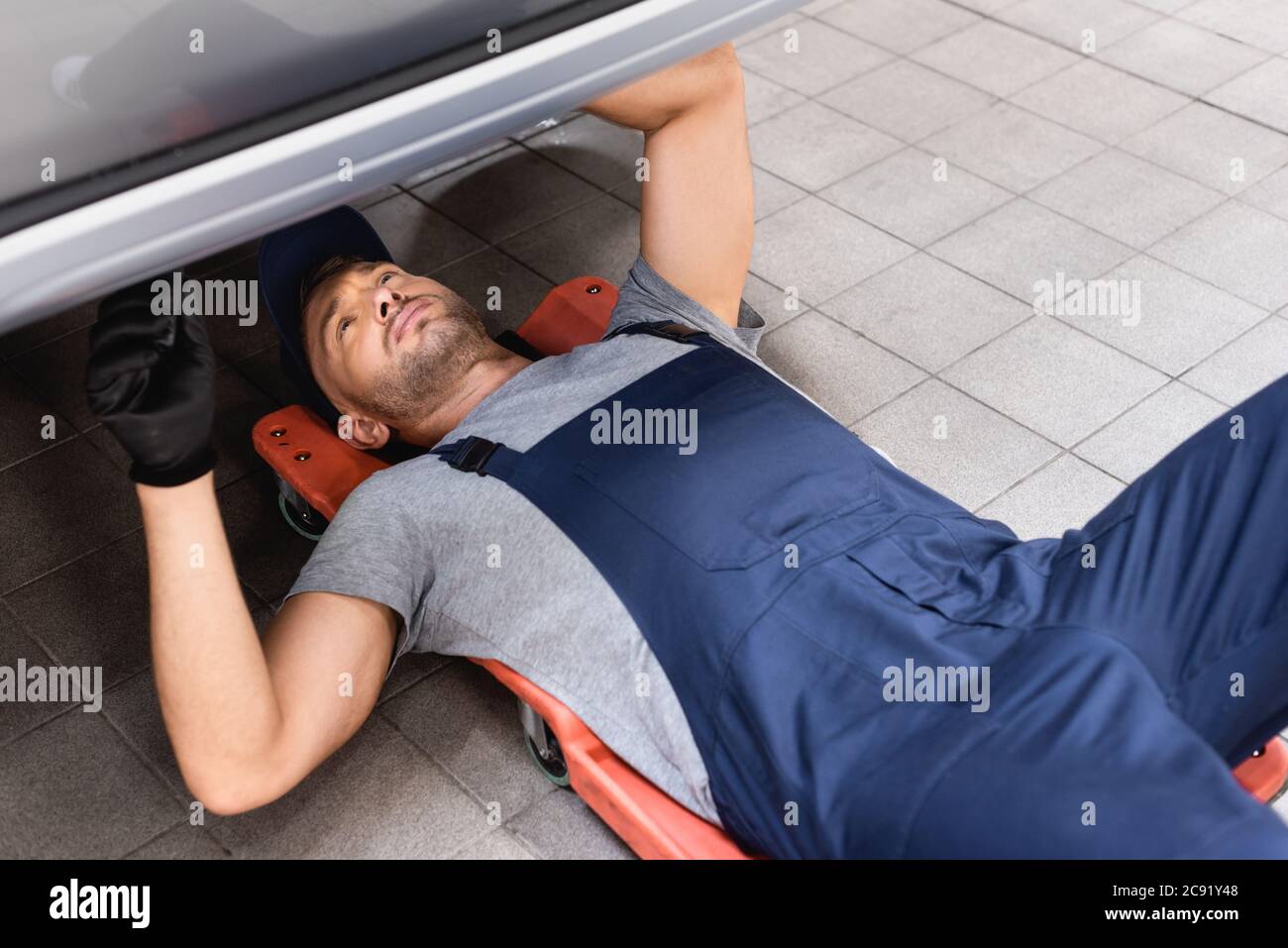 Man lying under car hi-res stock photography and images - Alamy