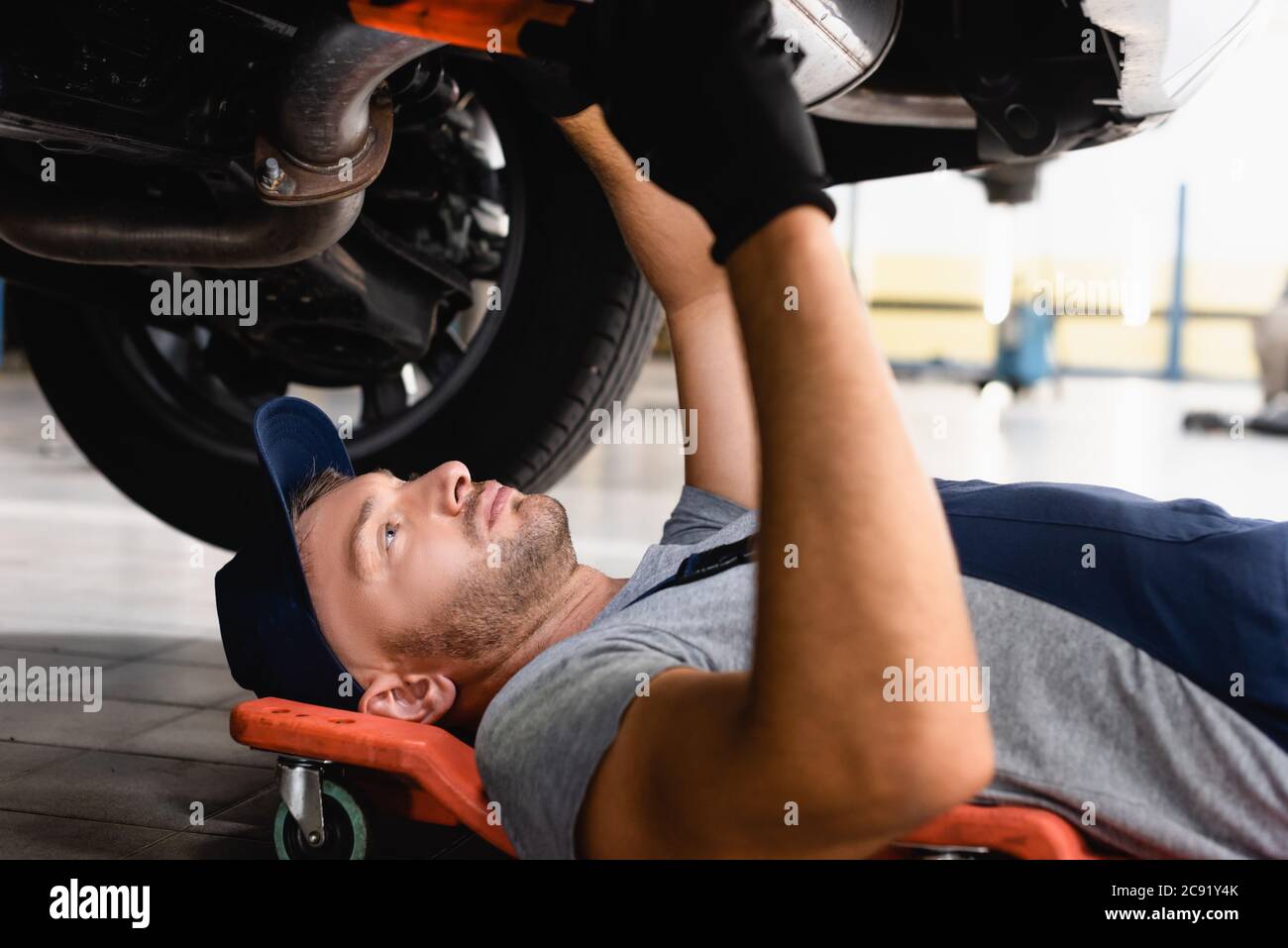 Man lying under car hi-res stock photography and images - Alamy