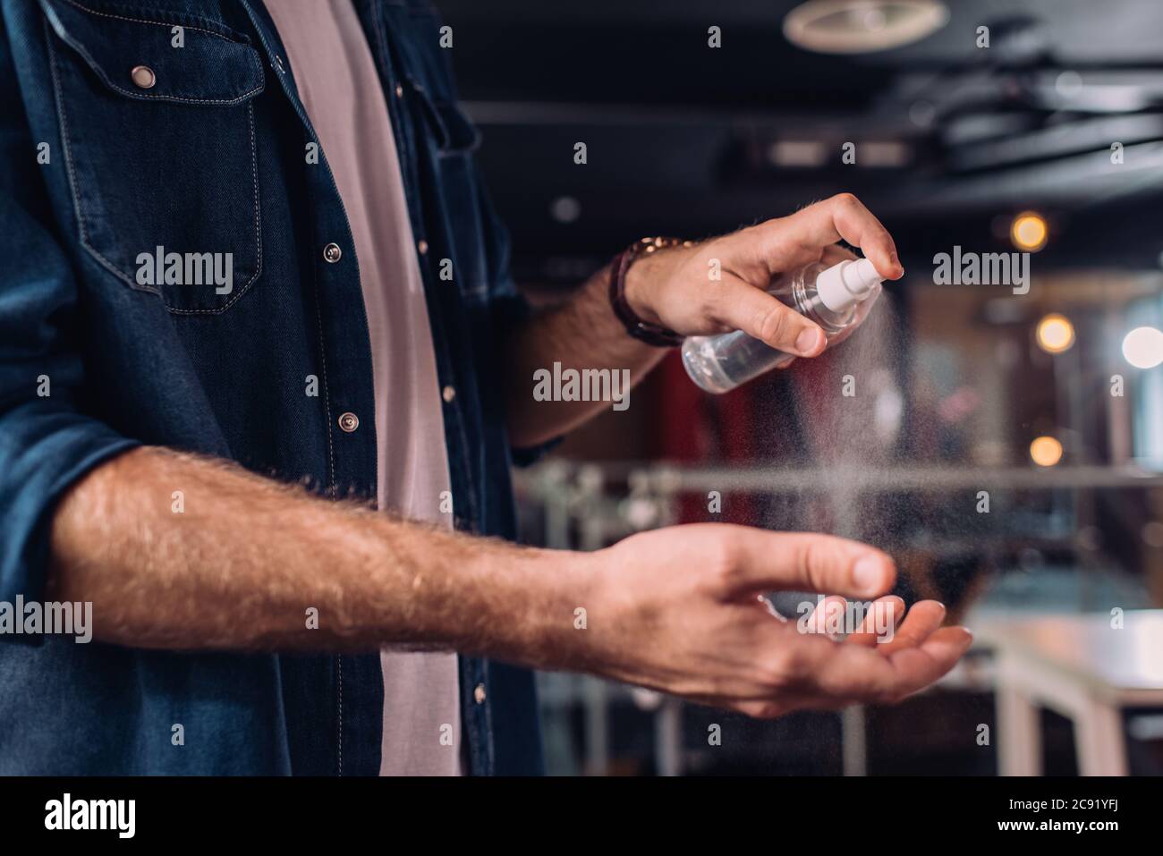 Man spray hands sanitizer disinfection hi-res stock photography and ...