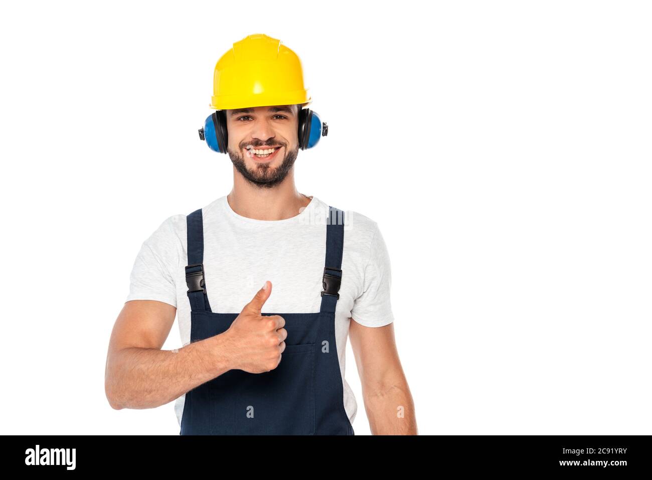 Handsome workman smiling and showing like gesture isolated on white ...