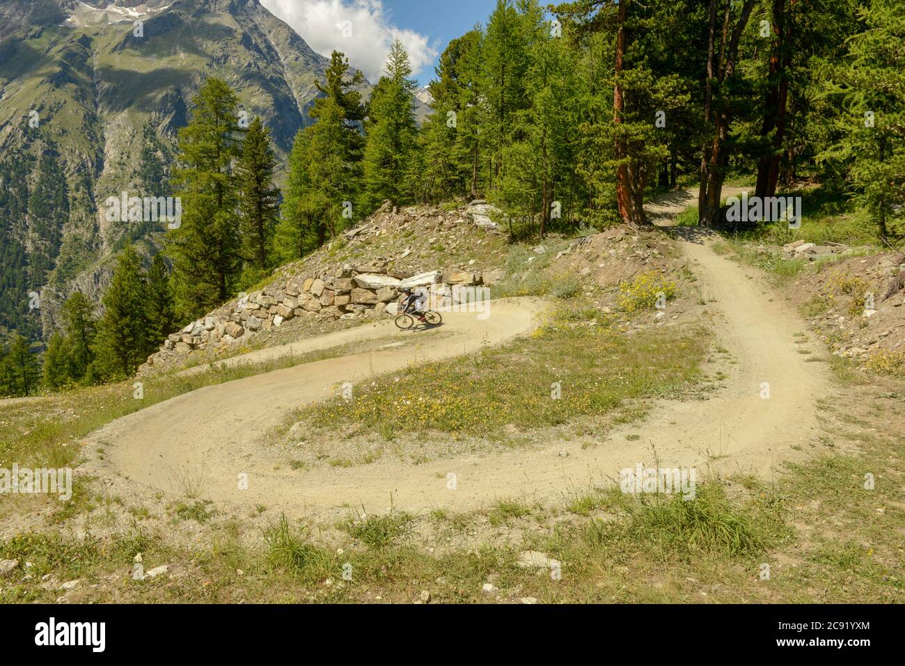 Zermatt, Switzerland - 19 July 2020: boy driving a mtb on a flow trail ...