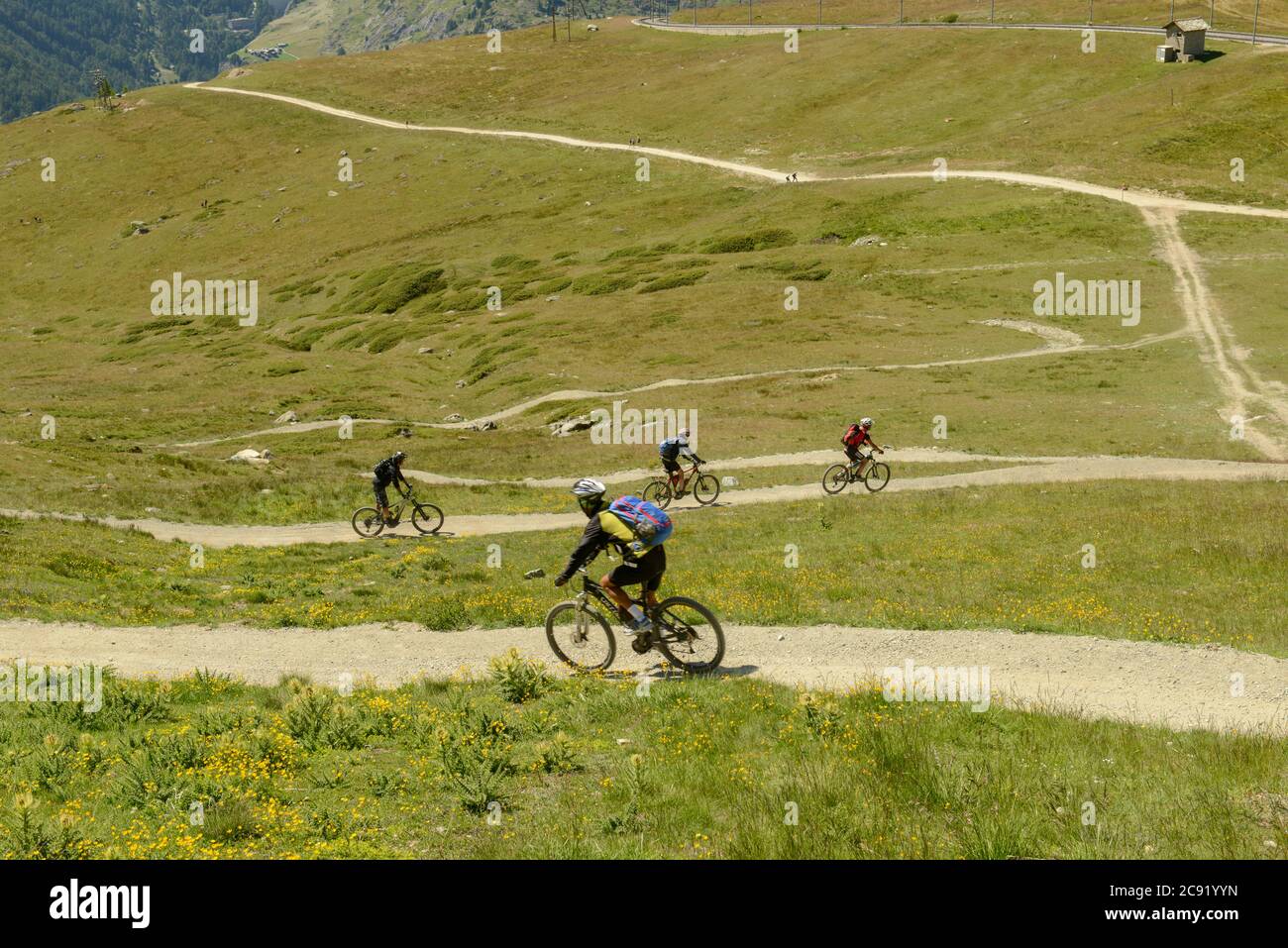 Zermatt, Switzerland - 19 July 2020: people driving a mtb on a flow ...