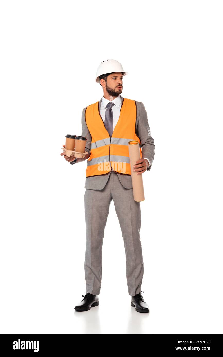 Engineer in suit and hardhat holding paper cups and blueprint tube on ...