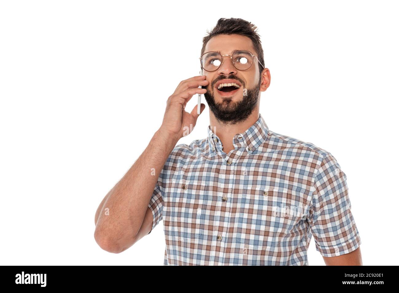 Positive nerd talking on smartphone isolated on white Stock Photo - Alamy