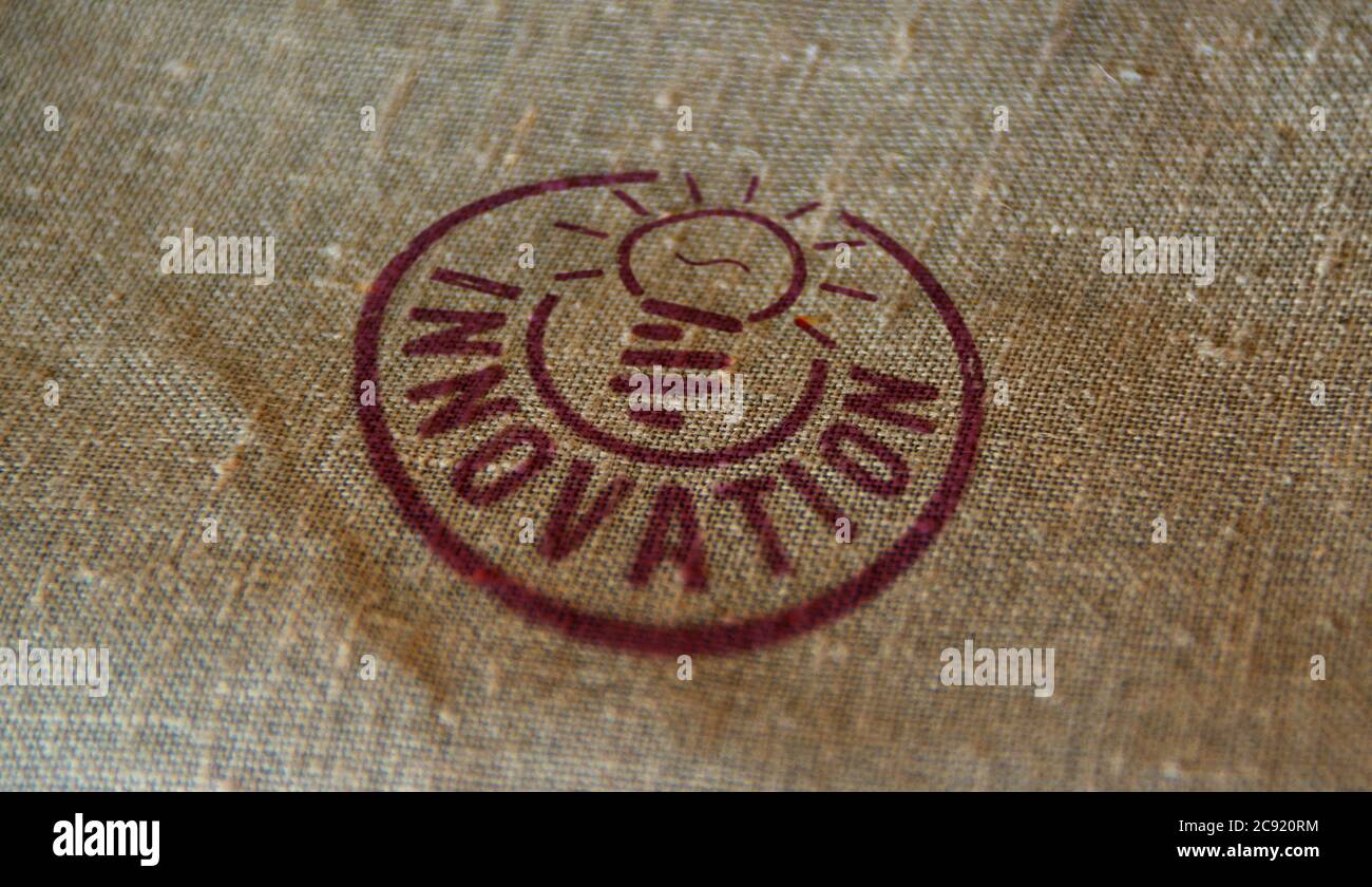 Innovation stamp printed on linen sack. New idea, success, progress ...