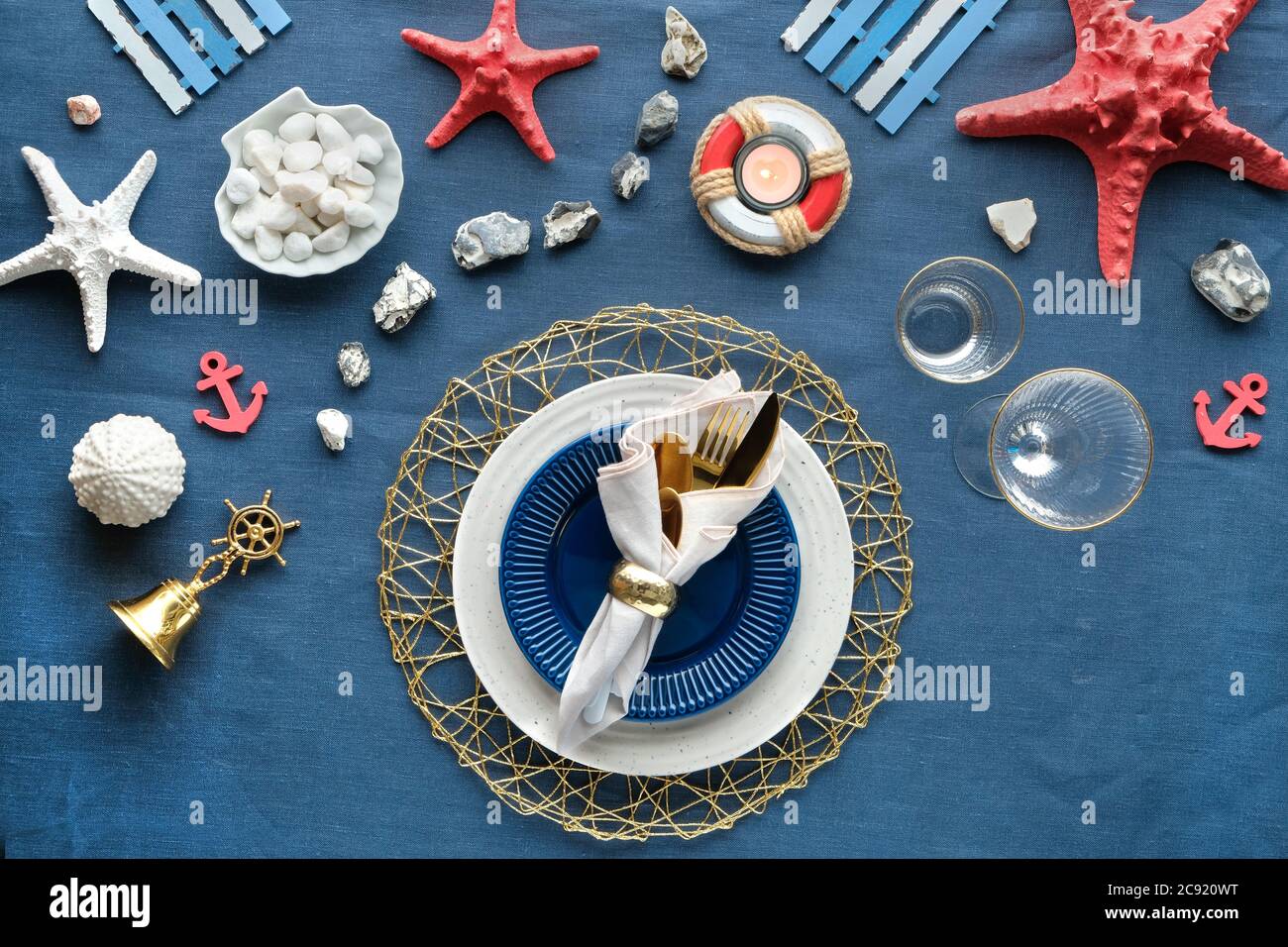Contemporary nautical table setting with sea decorations on classic ...