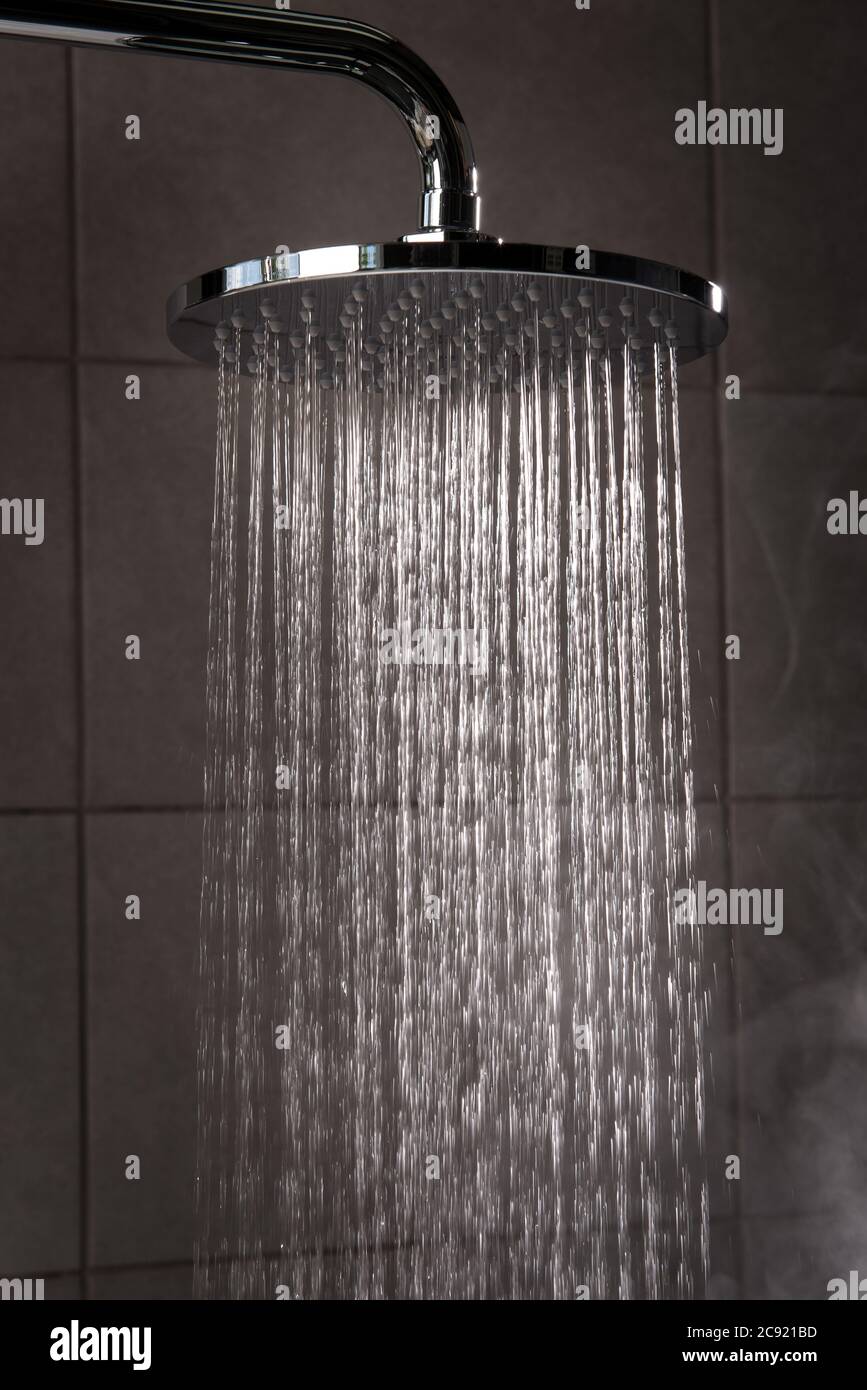 Modern style steel circular shower head in the bathroom Stock Photo - Alamy