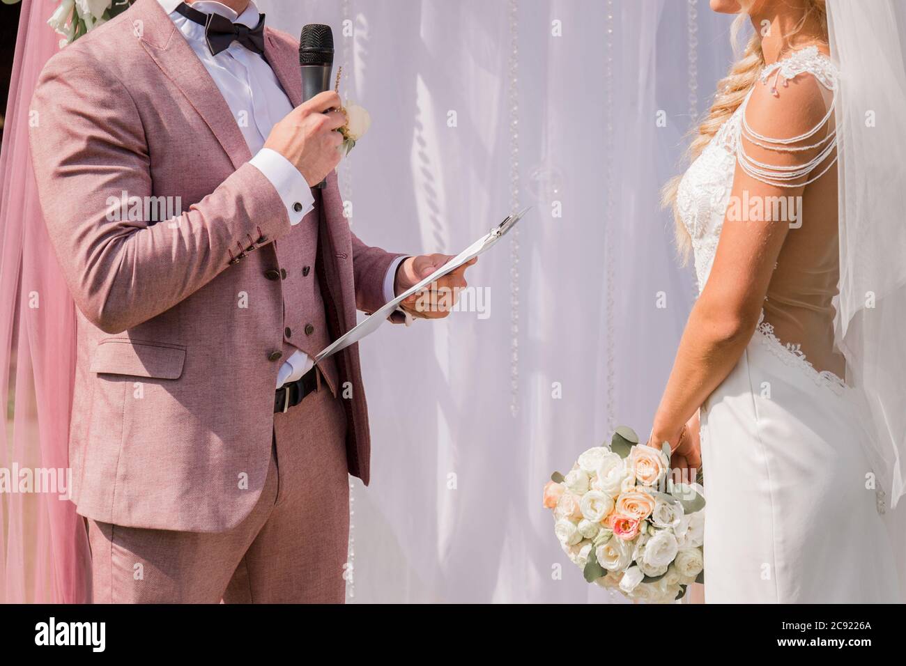 a groom with microphone at wedding ceremony Stock Photo - Alamy