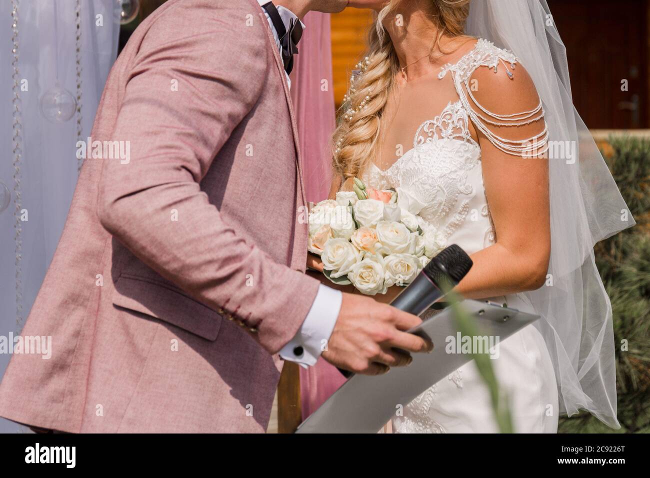 a groom with microphone at wedding ceremony Stock Photo - Alamy