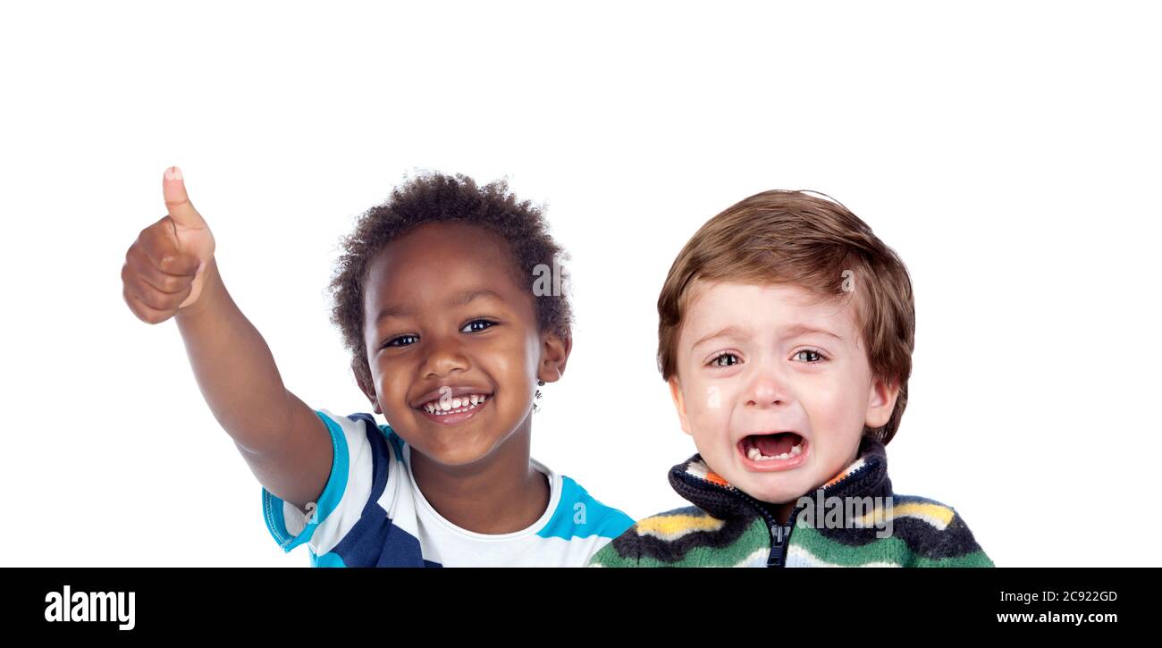 African child saying Ok with his thumb up and a baby crying isolated on ...