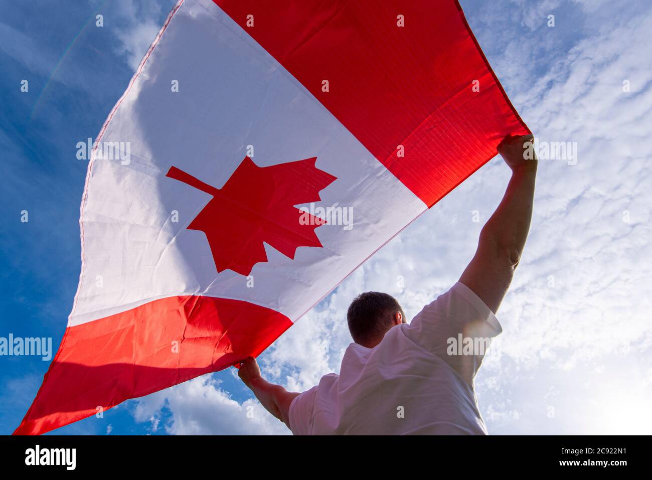 Canadian man holding canadian flag hi-res stock photography and images ...
