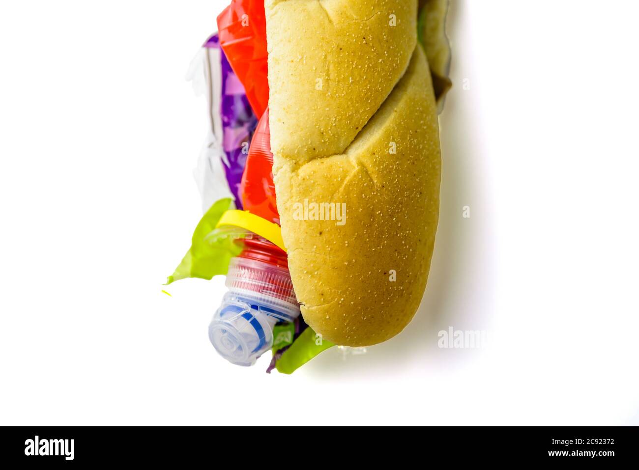 Hotdog filled with plastic waste and paper cardboard. Recycled waste in ...