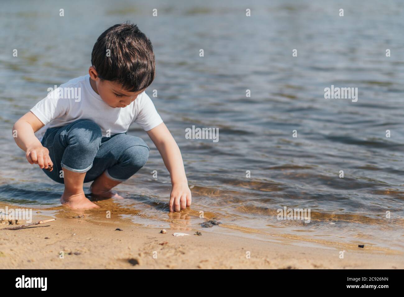 Child feet sand hi-res stock photography and images - Alamy