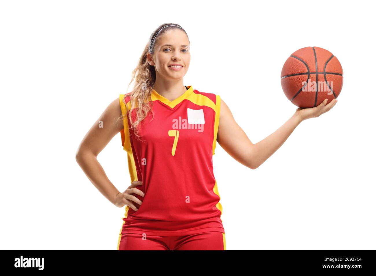 Female basketball player posing with a ball isolated on white ...