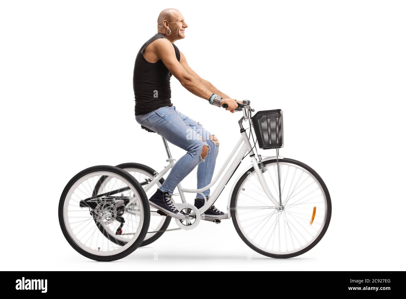 Profile shot of a middle aged man riding a tricycle isolated on white ...