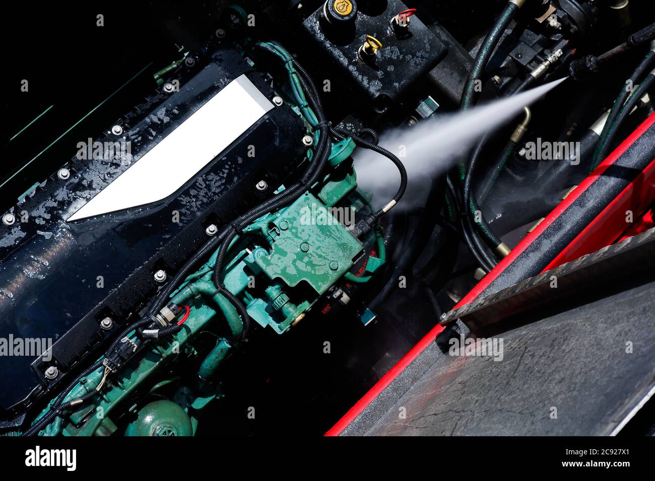 Washing the engine with high water pressure Stock Photo - Alamy