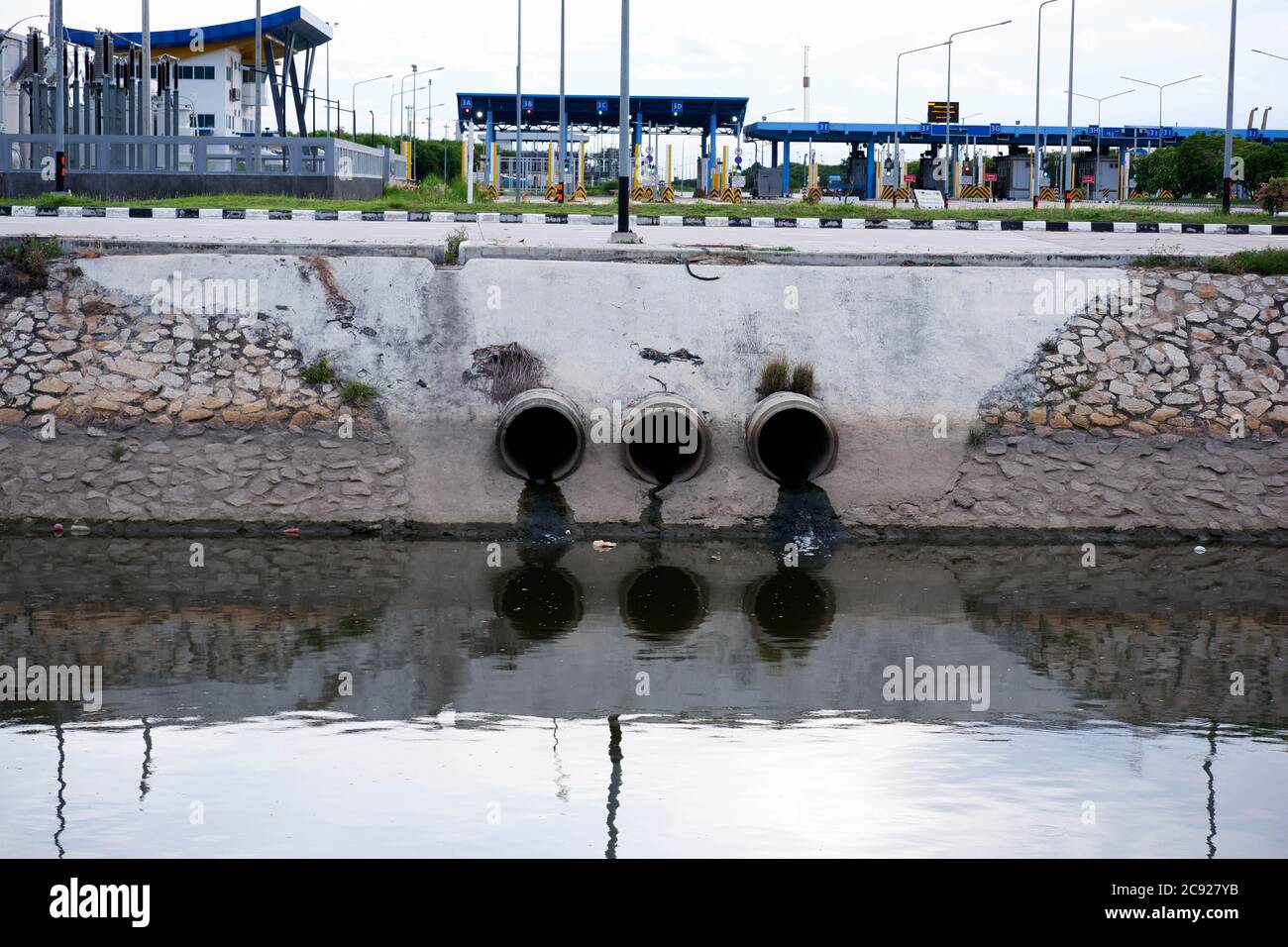 Drain the waste into the river Stock Photo - Alamy