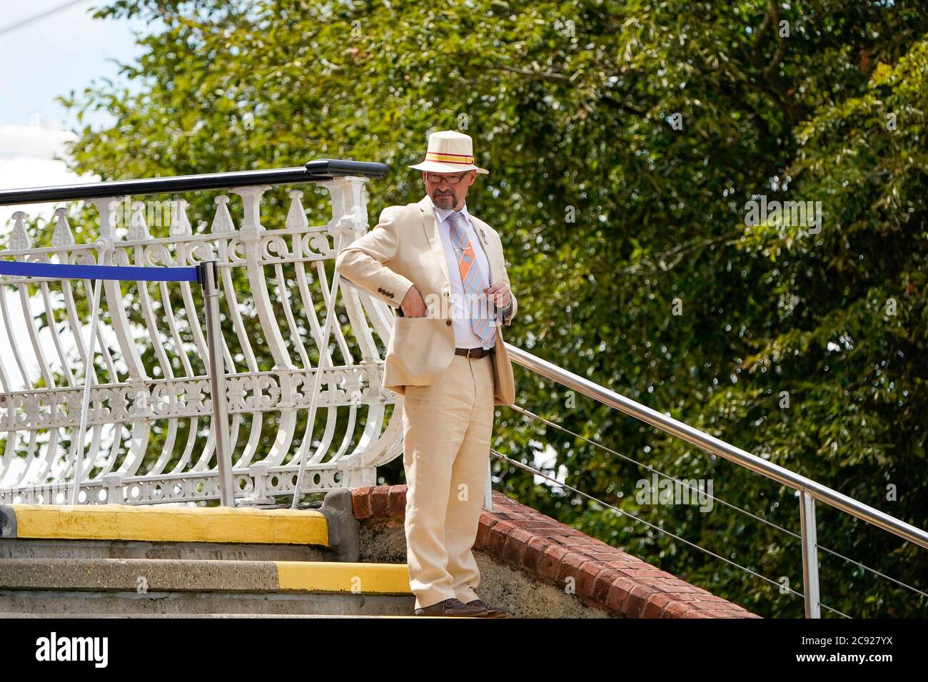A race horse owner looks on during day one of the Goodwood Festival at ...