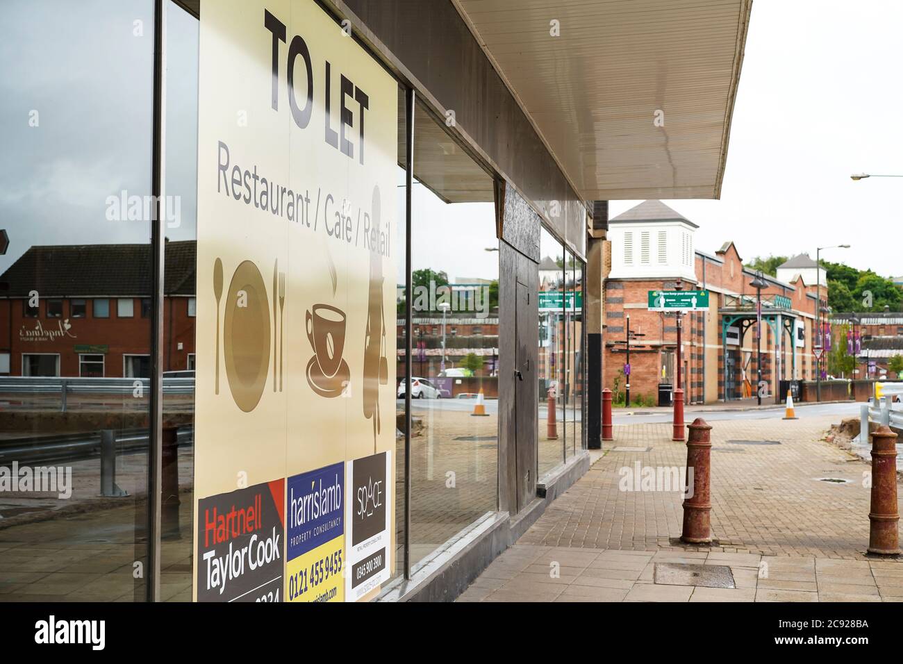 Close up window of another empty shop, retail unit displaying 'To Let ...