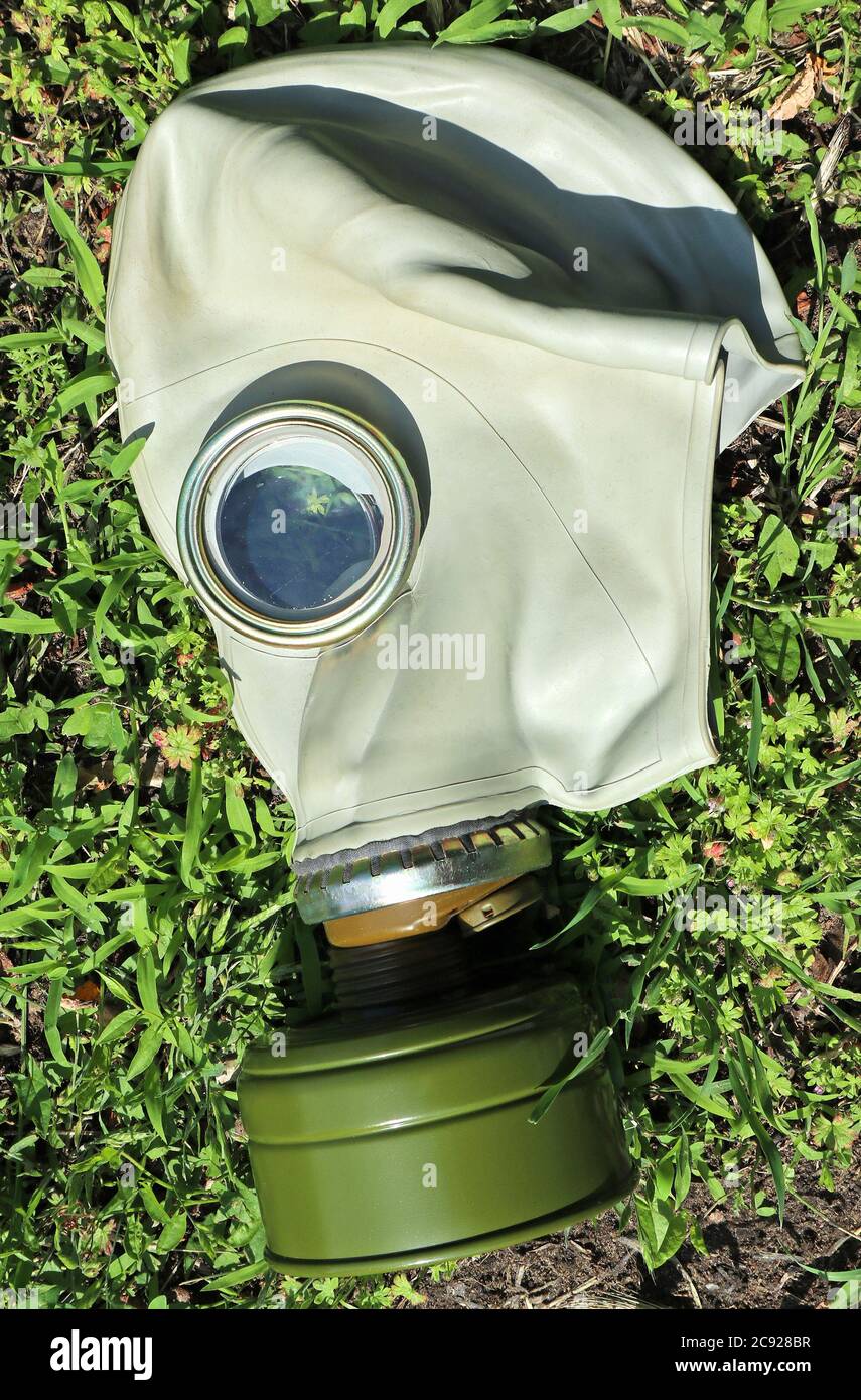 Gas mask in the grass outdoors Stock Photo - Alamy