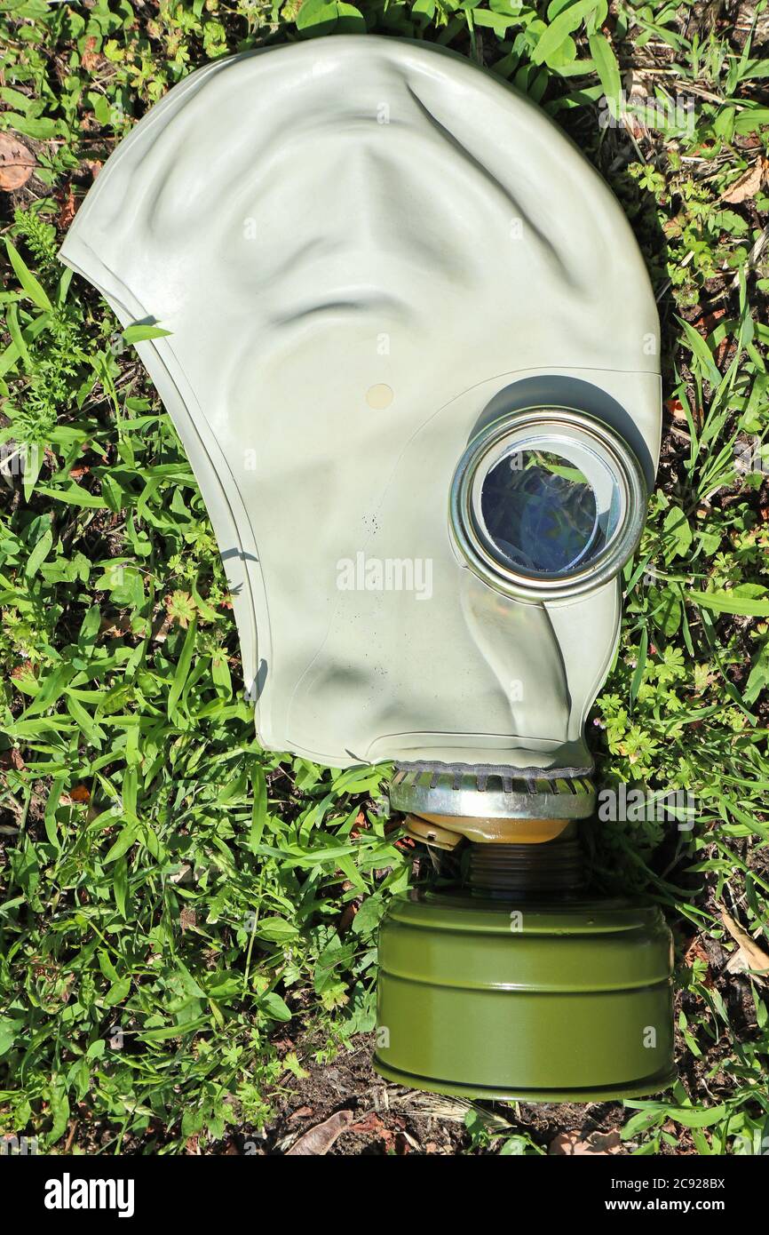 Gas mask in the grass outdoors Stock Photo - Alamy