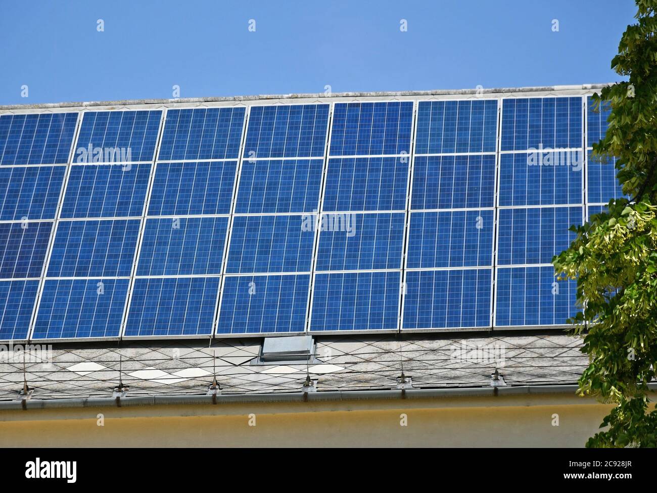 Solar panels on the top of a building Stock Photo - Alamy
