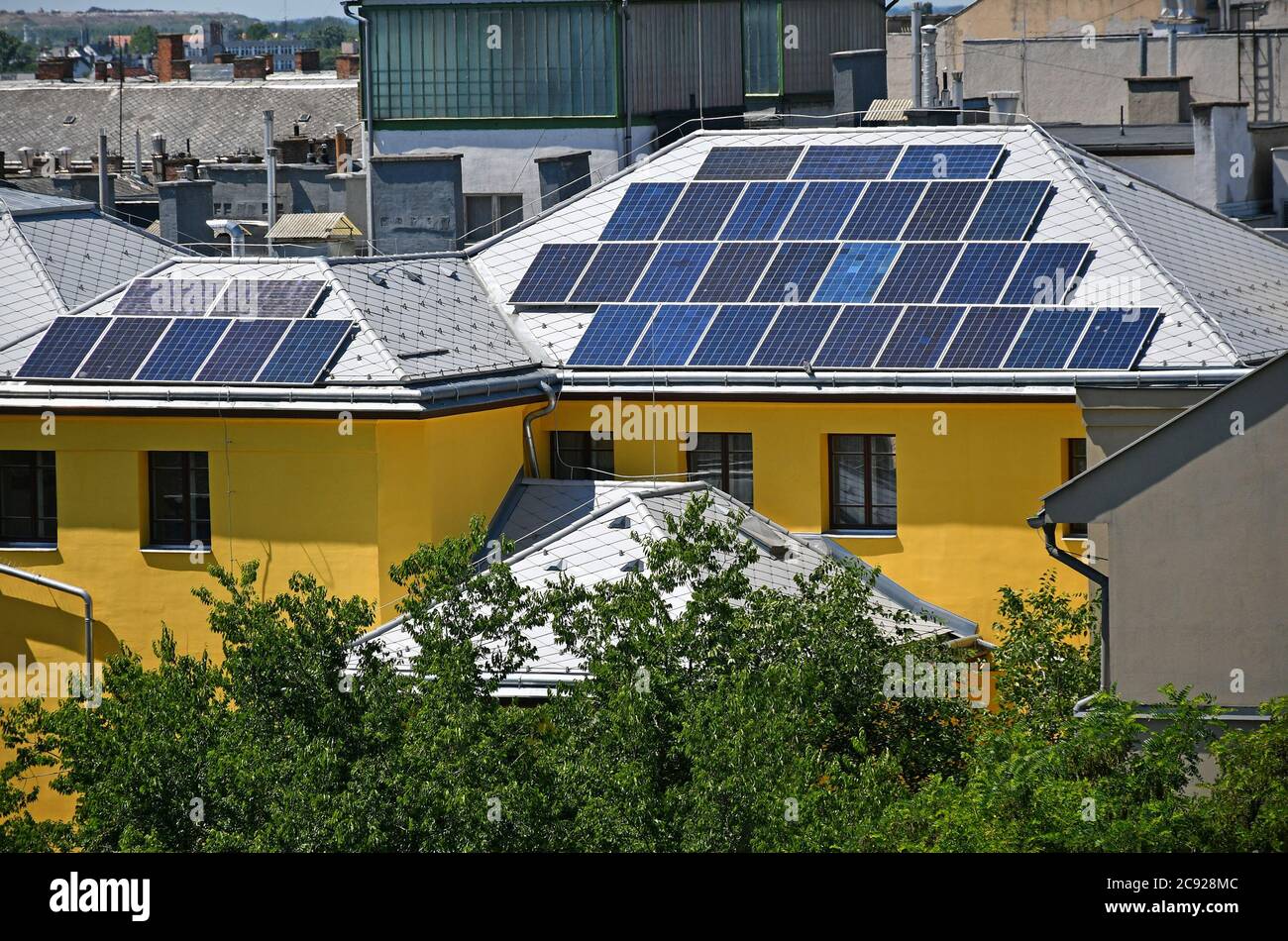 Solar panels on the top of a building Stock Photo - Alamy