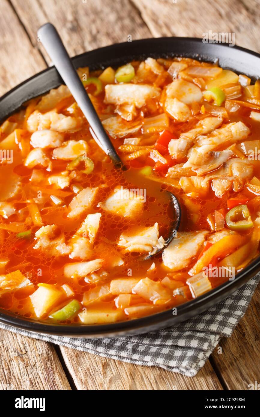 Bermuda Fish Chowder closeup in the plate on the table. Vertical Stock ...