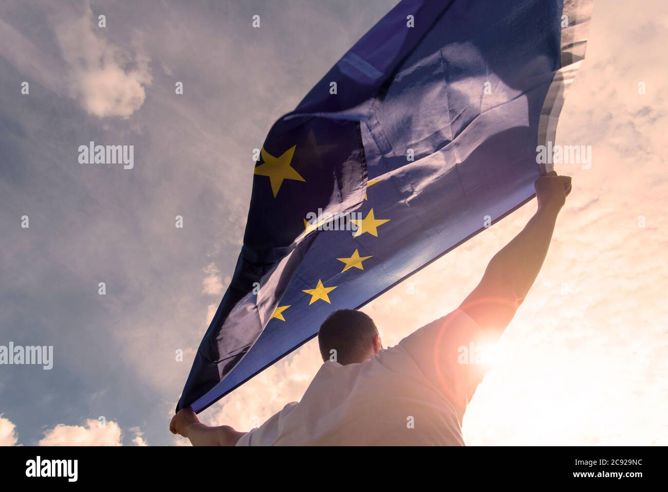 Man holding EU Flag or European Union flag, concept picture Stock Photo ...