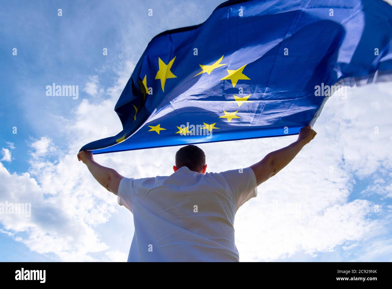 Man holding EU Flag or European Union flag, concept picture Stock Photo ...